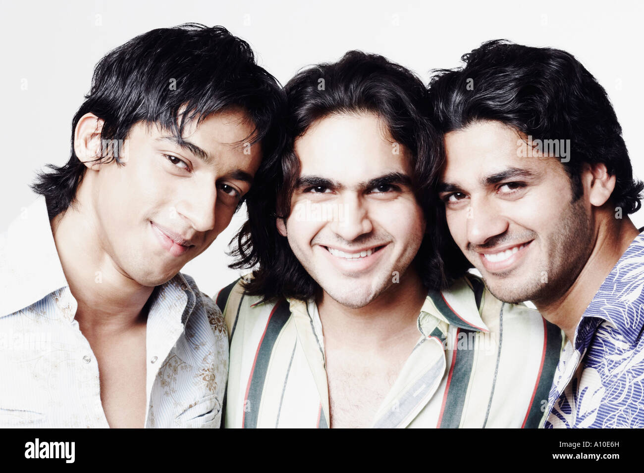 Portrait of three young men smiling Stock Photo - Alamy