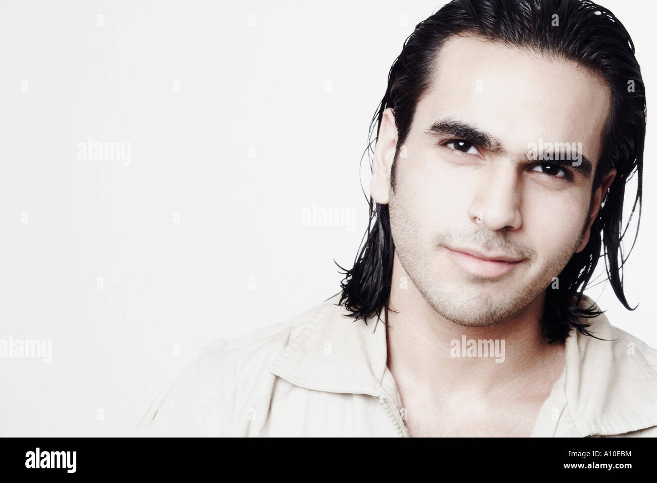 Portrait of a young man grinning Stock Photo - Alamy