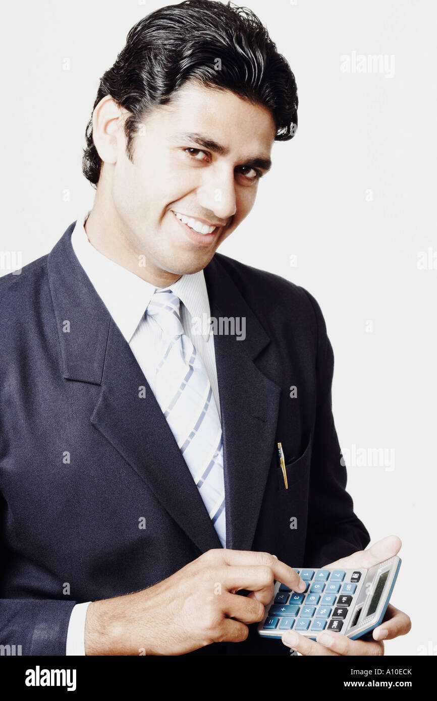 Portrait of a businessman holding a calculator Stock Photo - Alamy