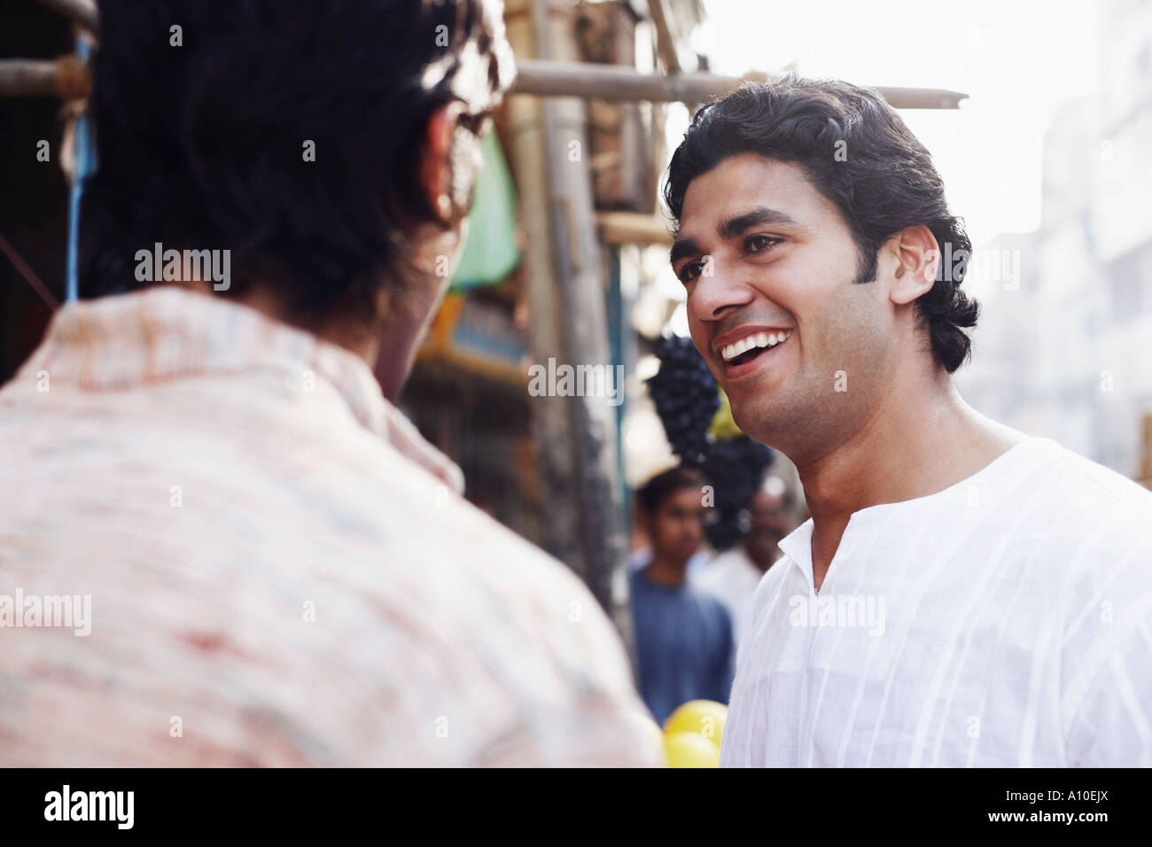 Side profile of two young men talking Stock Photo - Alamy Side profile of two young men talking Stock Photo - Alamy