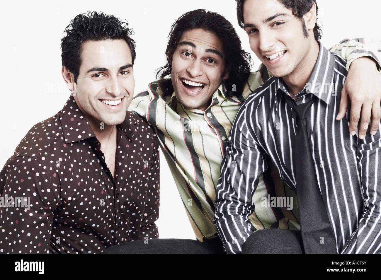Portrait of three young men smiling Stock Photo - Alamy