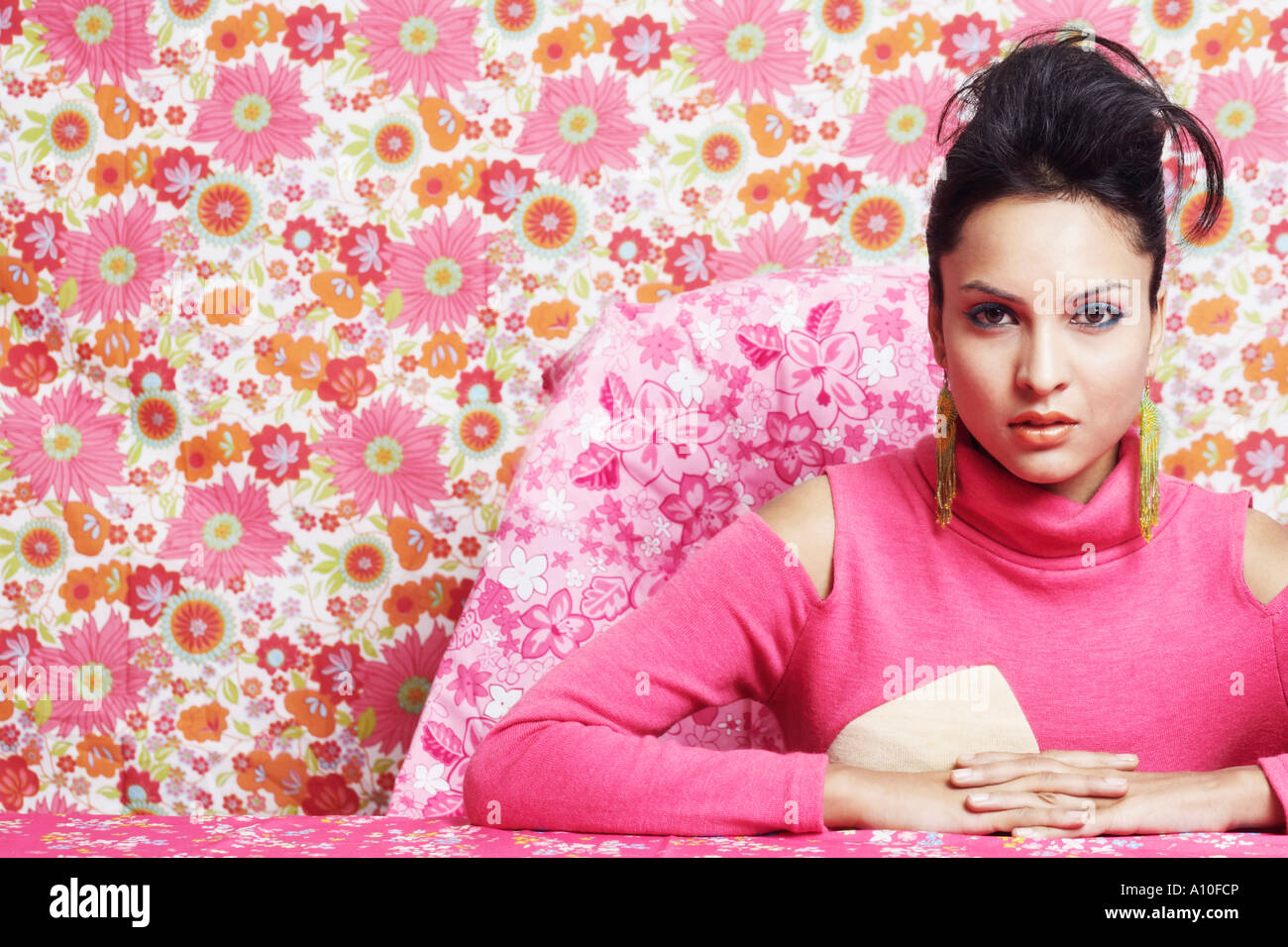 Portrait of a young woman looking serious Stock Photo - Alamy