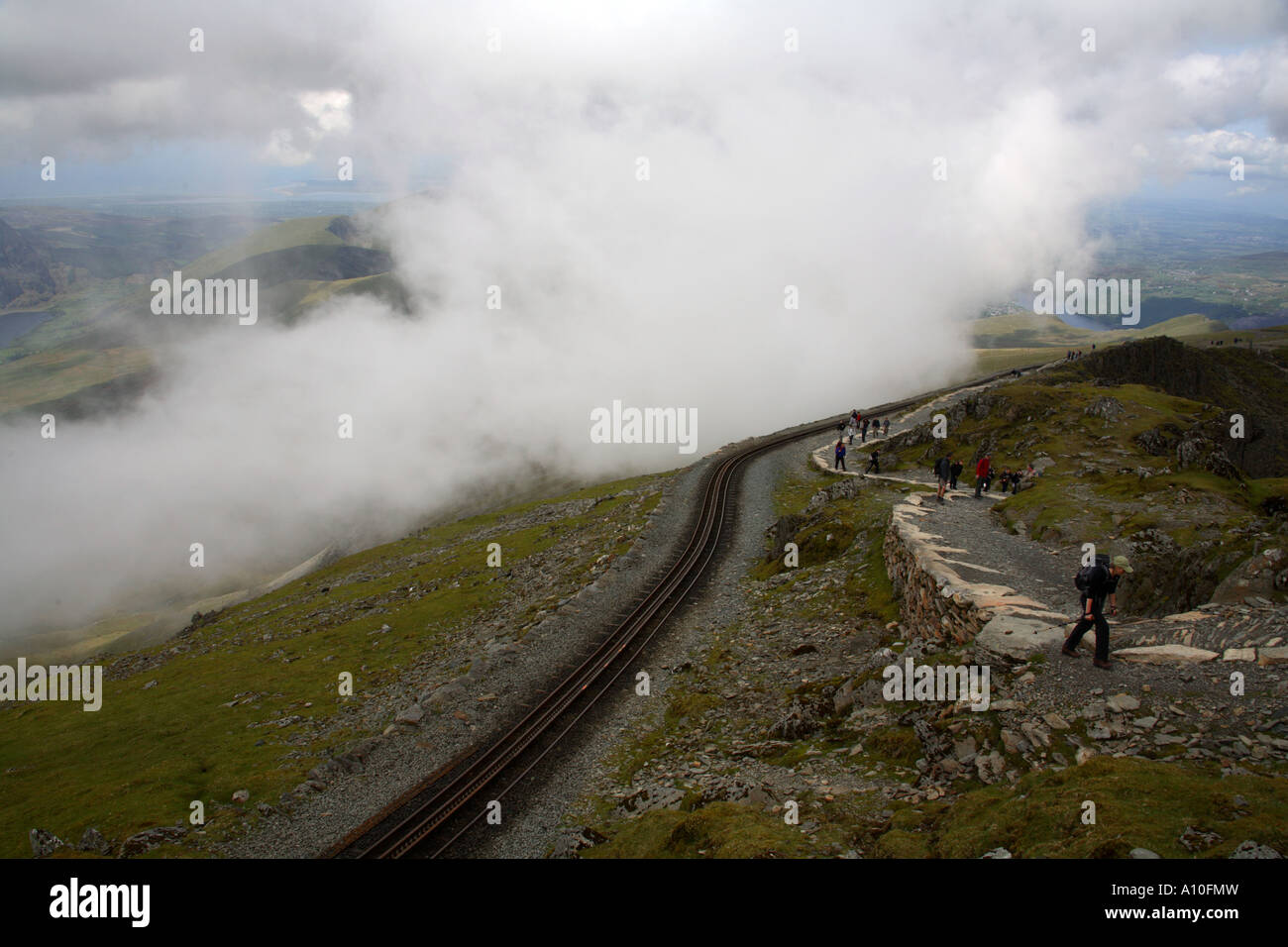 walking up snowdon next to railway track showing cloud wales Stock ...