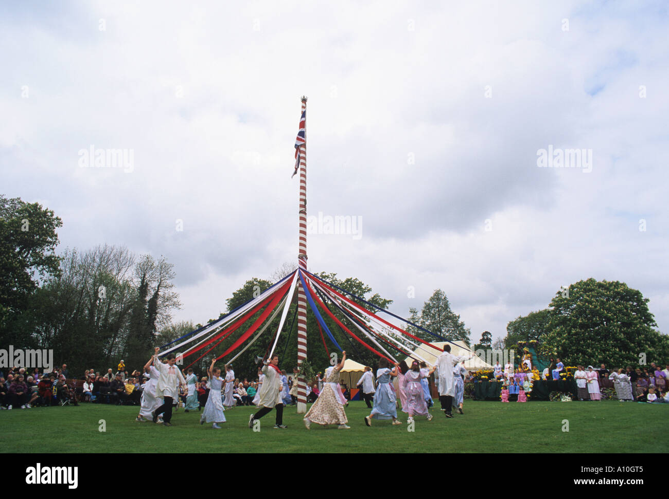 village children dance around the Maypole at Ickwell Green on May Day ...