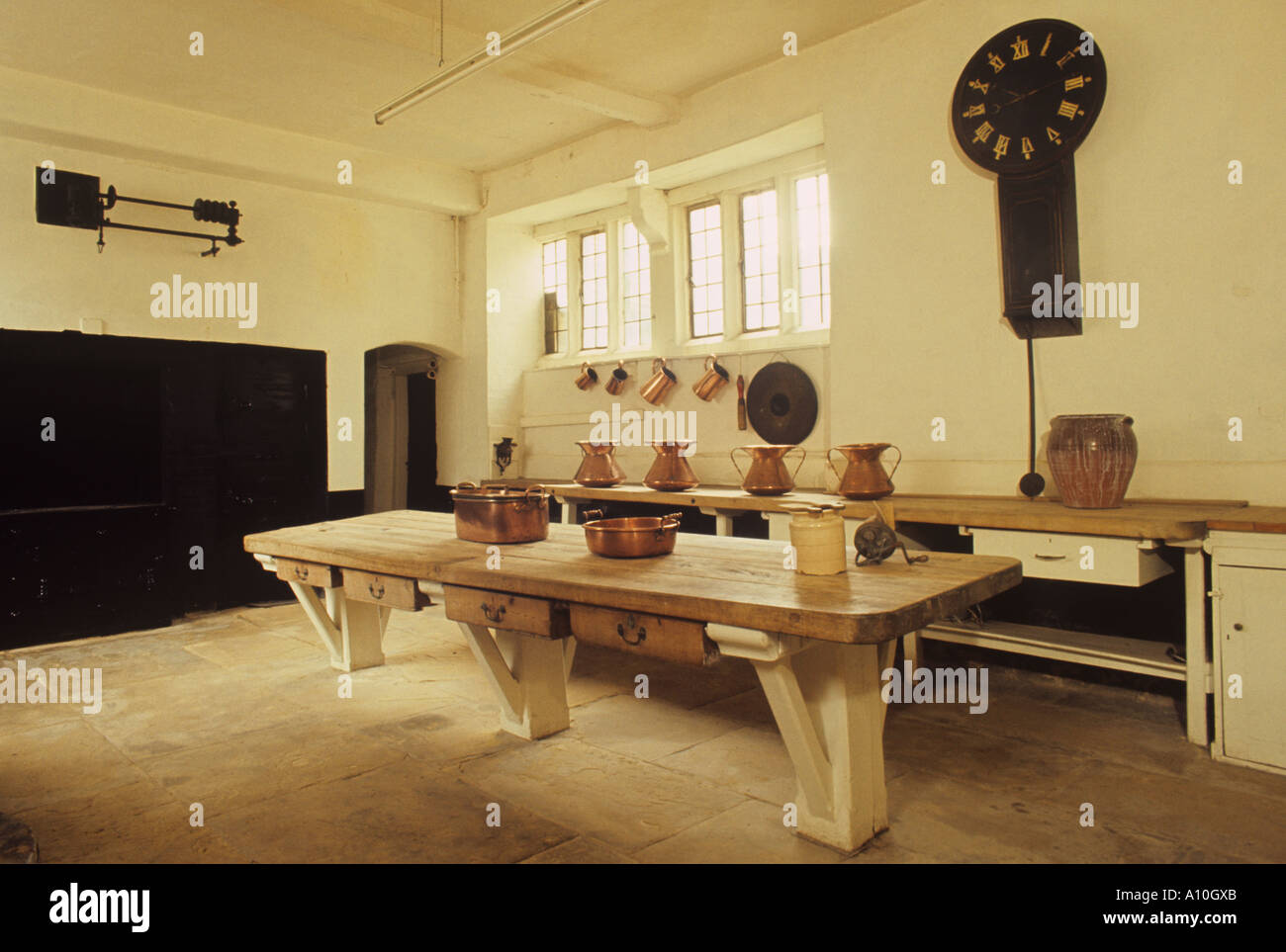 Rockingham Castle kitchens with copper cooking pots and measures ...