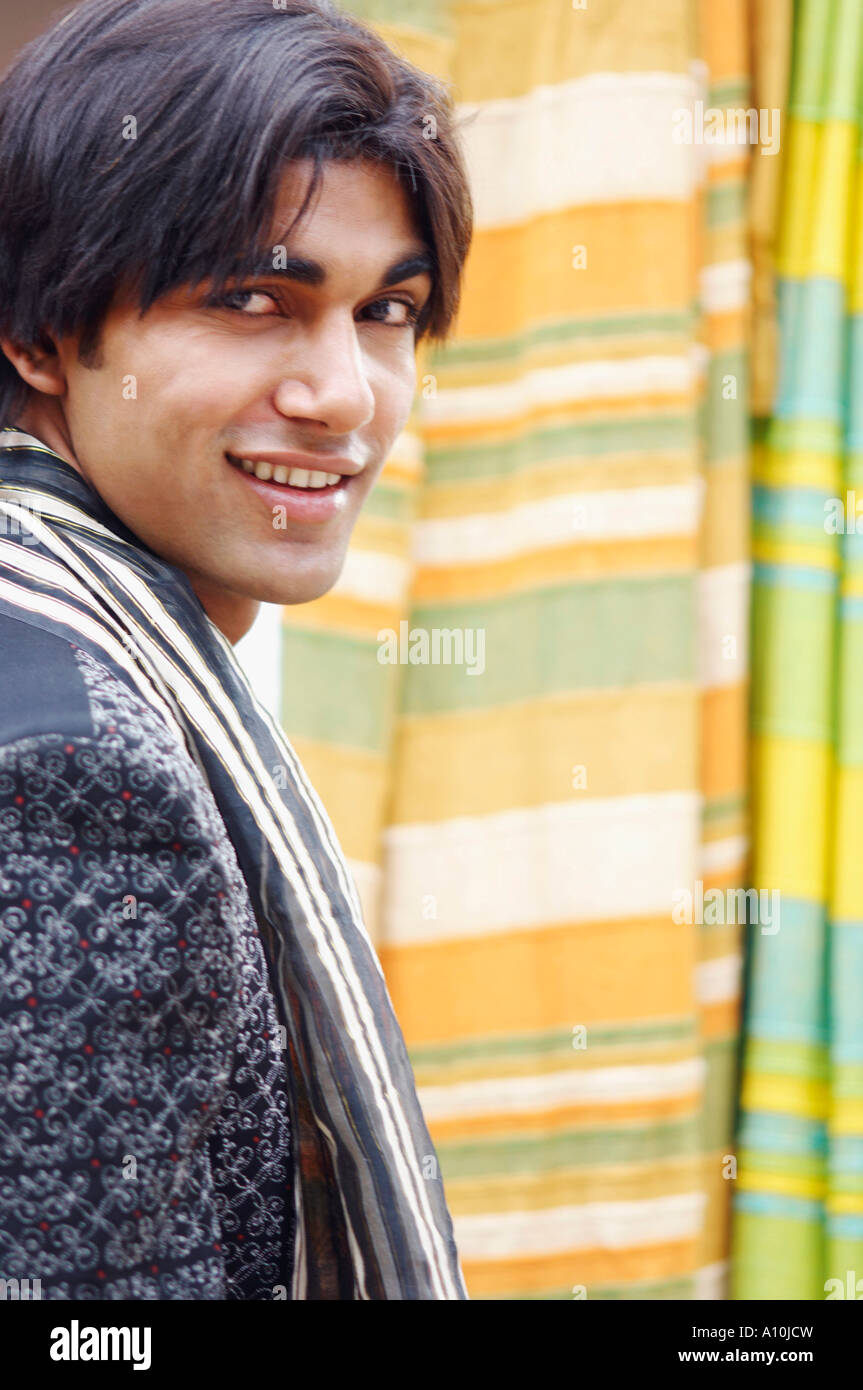 Side profile of a young man smiling Stock Photo - Alamy