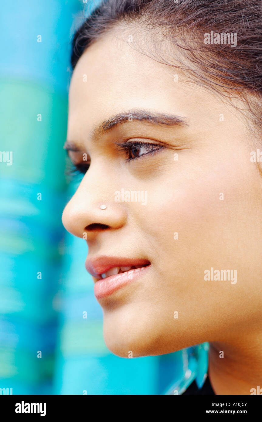 Side profile of a young woman's face Stock Photo - Alamy