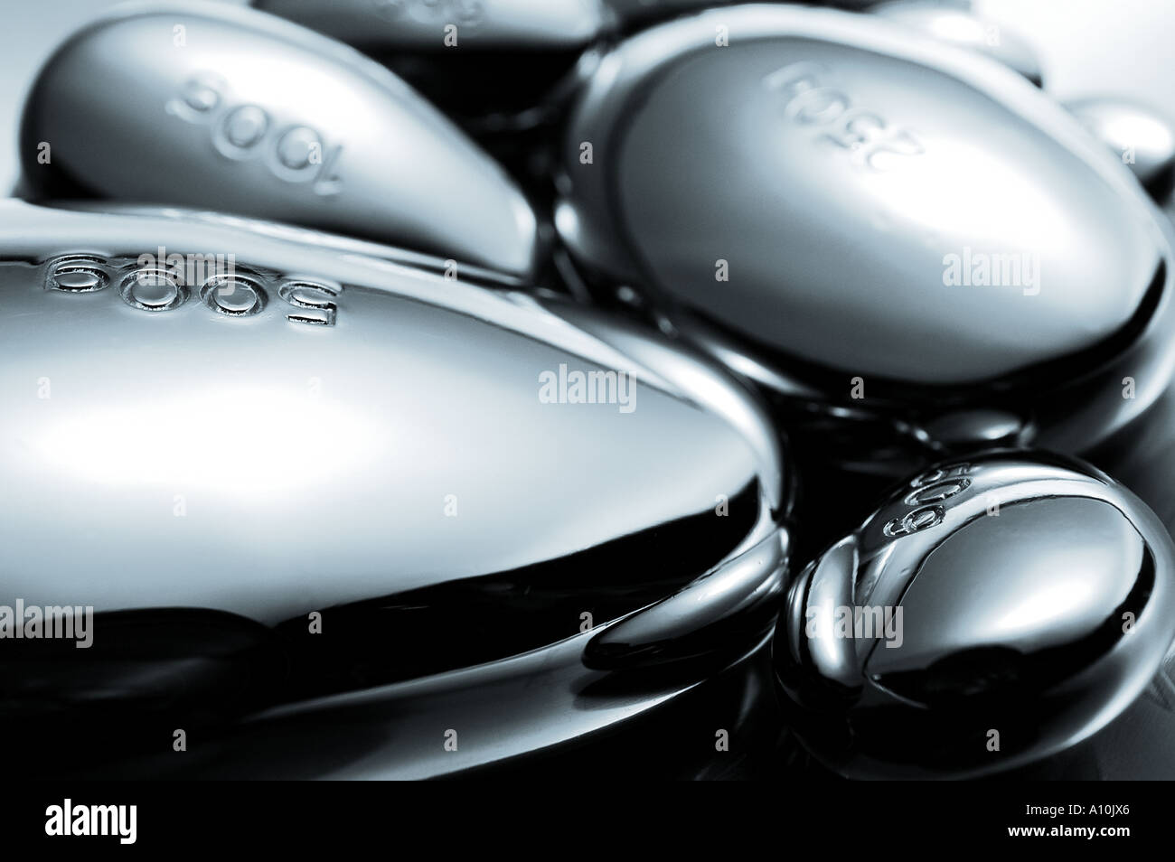 A close up study of chrome pebble weights in a weighing tray. Picture ...