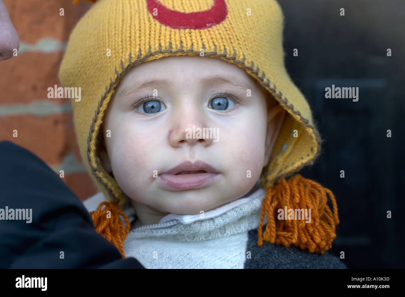 Toddler in hat held by mother Model released and Property released ...