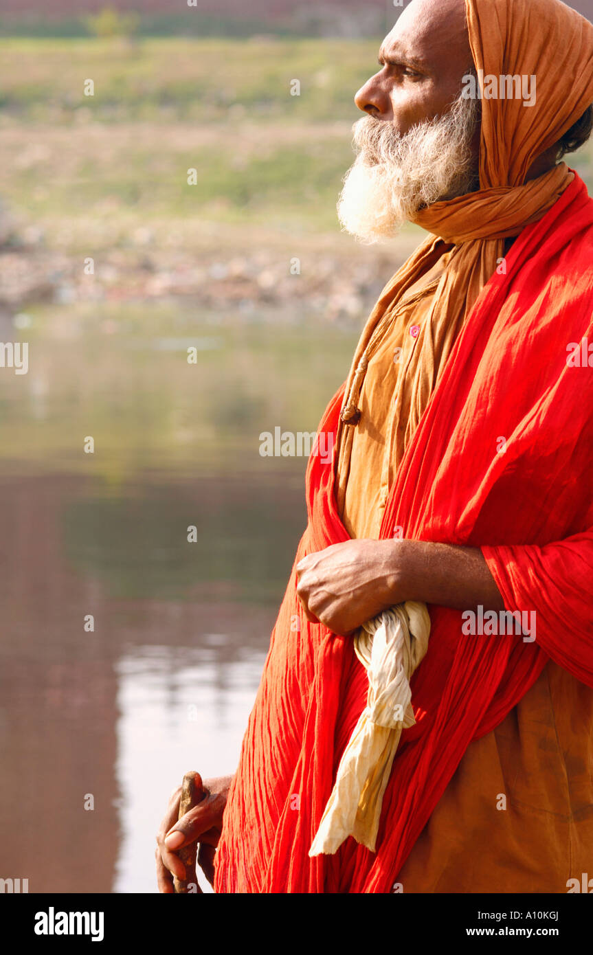 Side profile of a sadhu standing near the river Stock Photo - Alamy