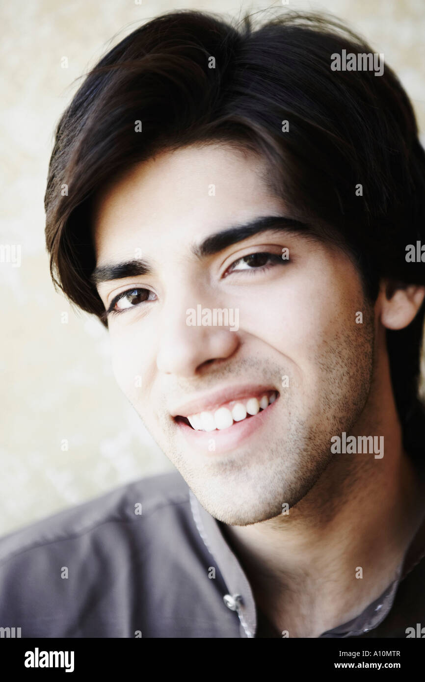 Portrait of a young man smiling Stock Photo - Alamy
