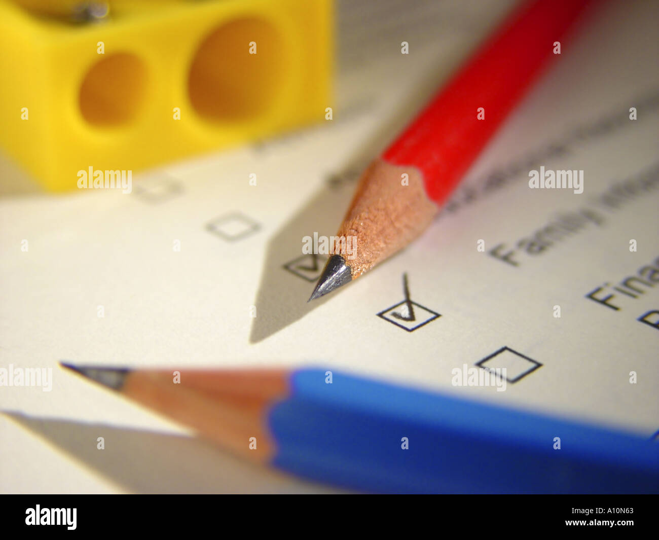 Close up image of a very sharp pencil point with check list and pencil ...