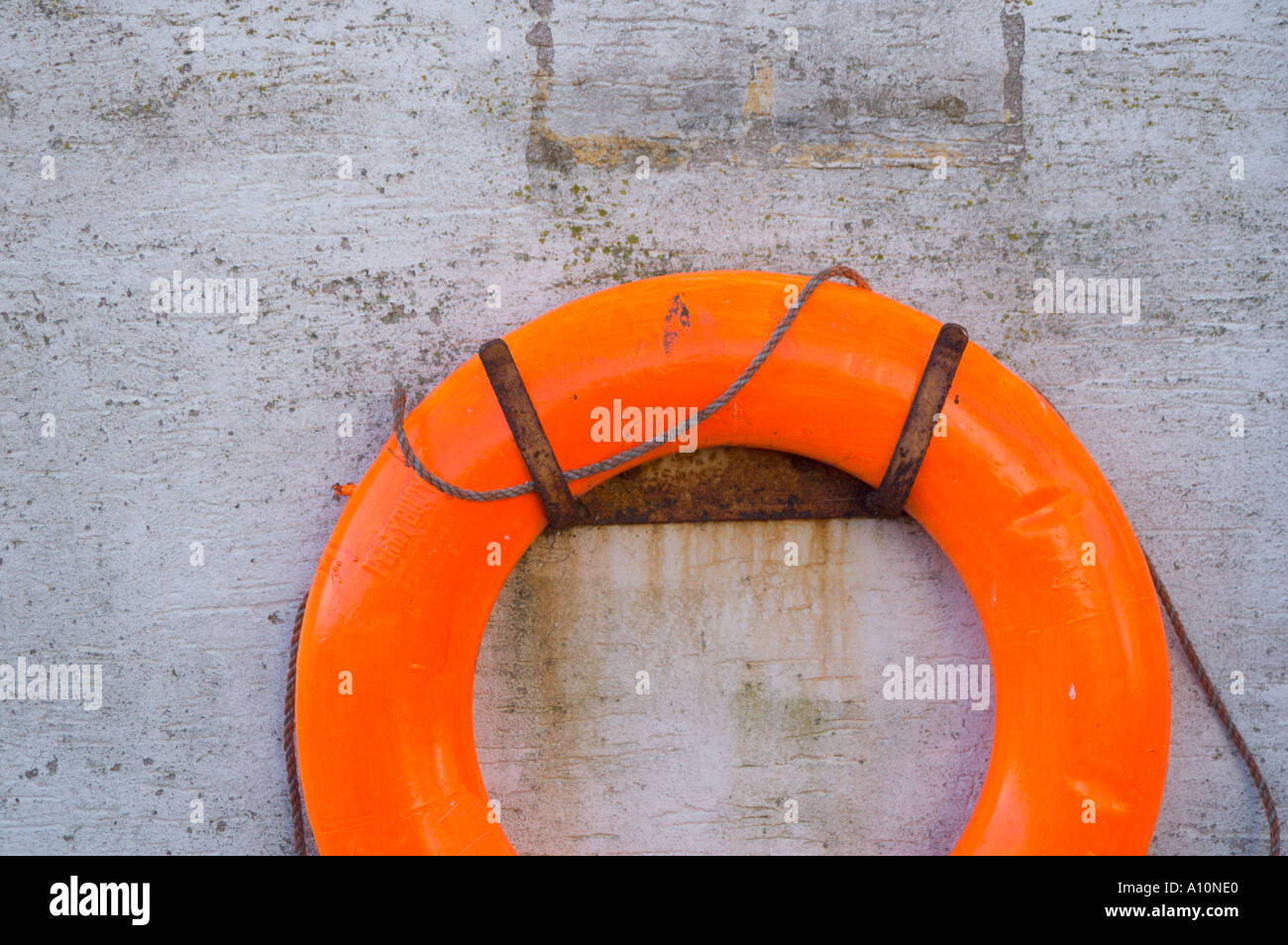 Brilliant orange safety colour of lifesaver ring in the fish market and ...