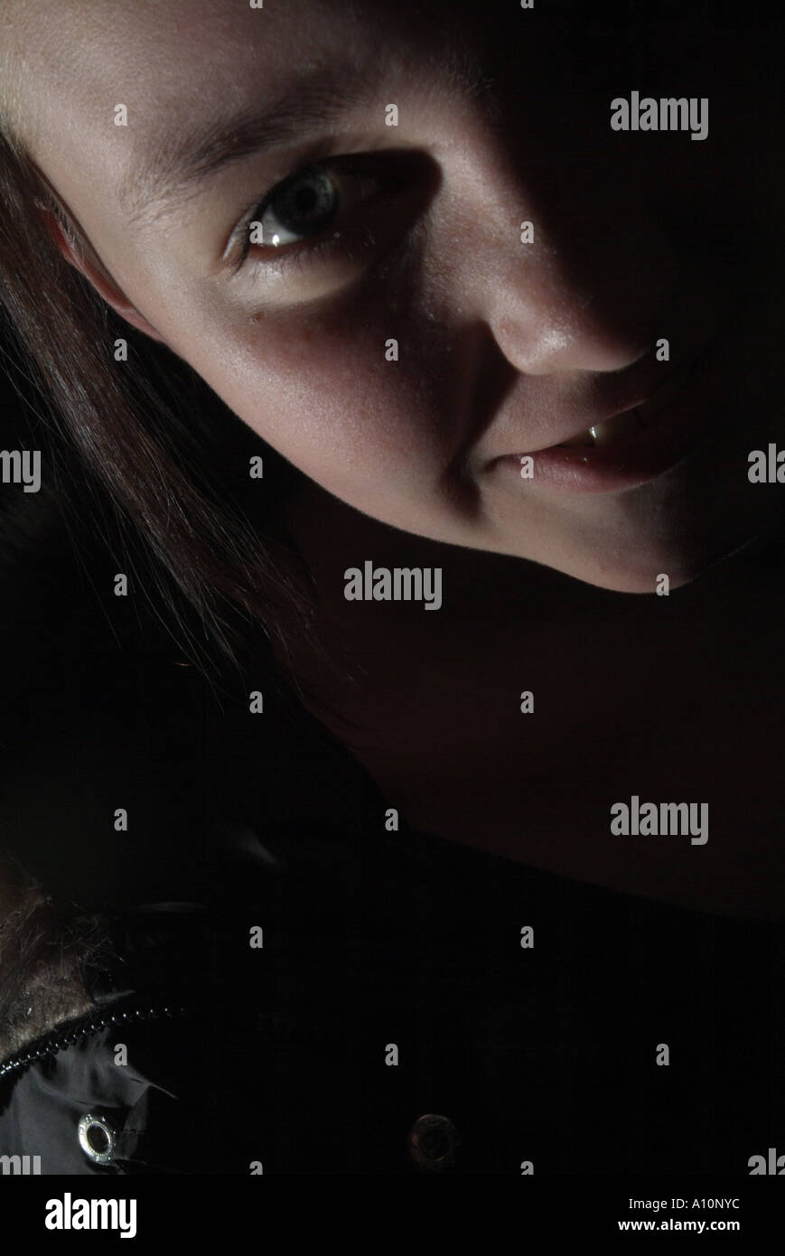 young girl face smiling in shadow Stock Photo - Alamy