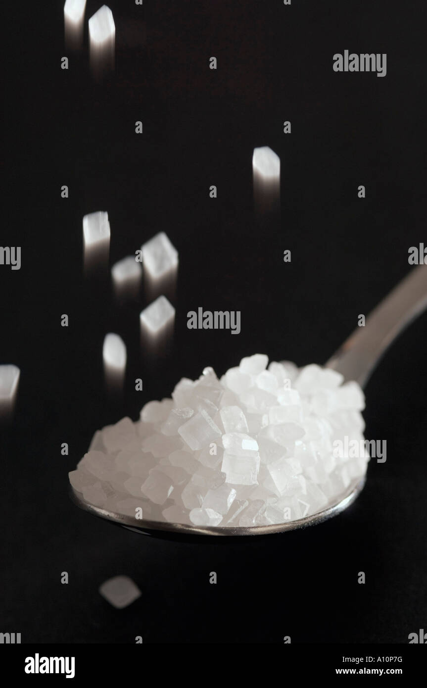 Close-up of a spoon full of sugar Stock Photo - Alamy