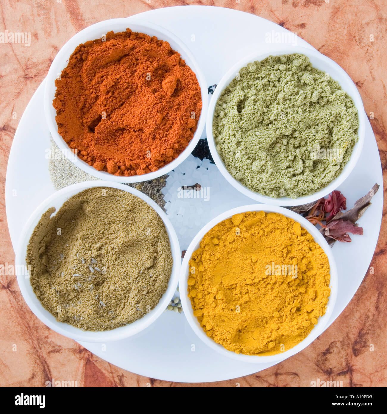 High angle view of spices in four bowls Stock Photo - Alamy