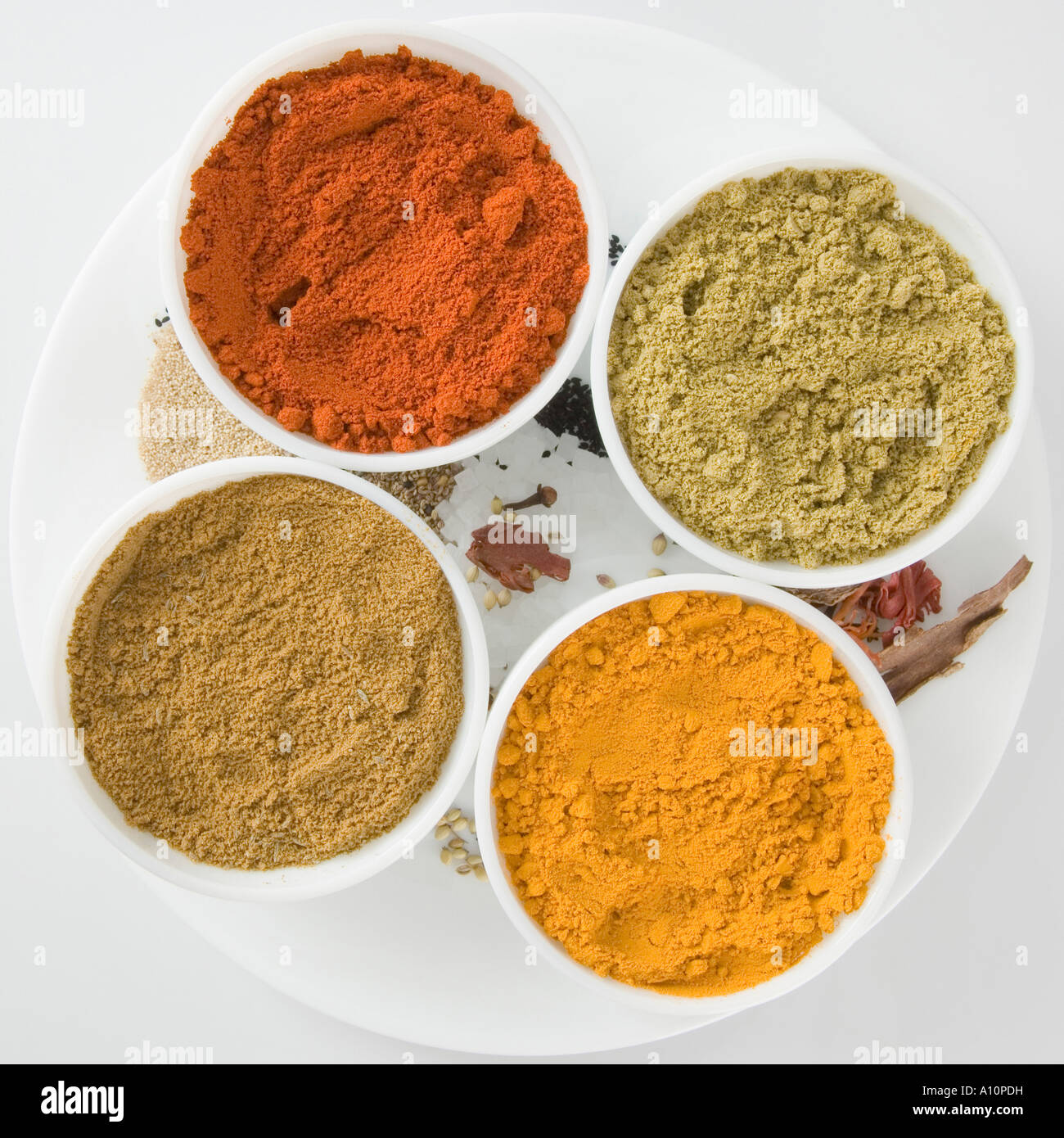 High angle view of spices in four bowls Stock Photo - Alamy