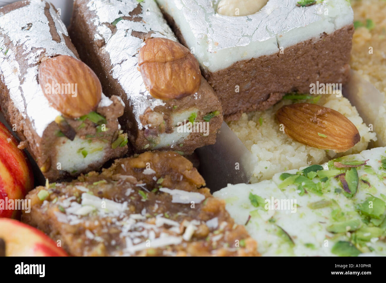 Close-up of sweets garnished with Almonds and Pistachio Stock Photo - Alamy