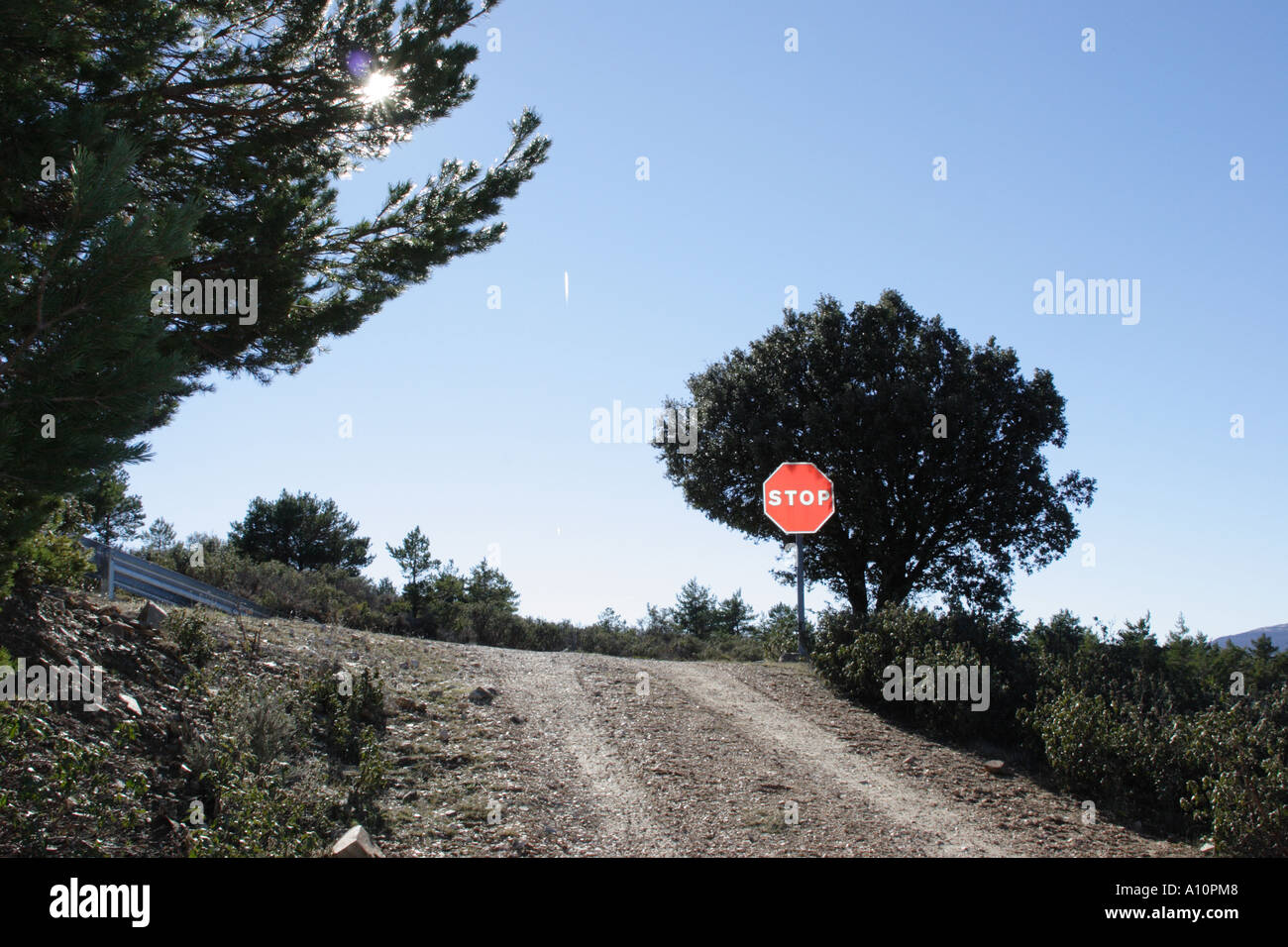Stop sign on dirt road Stock Photo - Alamy