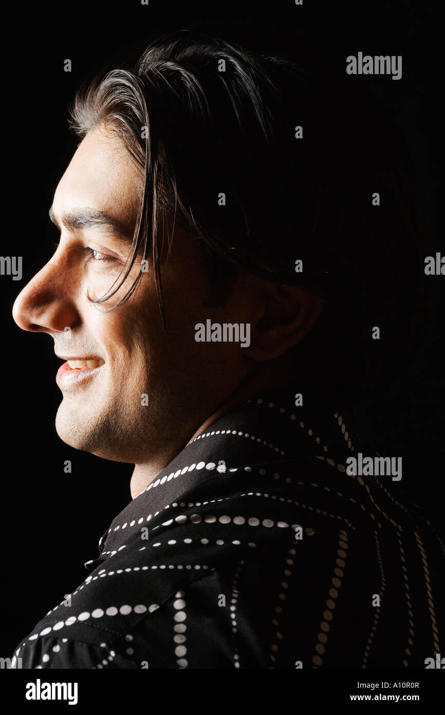Side profile of a young man smiling Stock Photo - Alamy