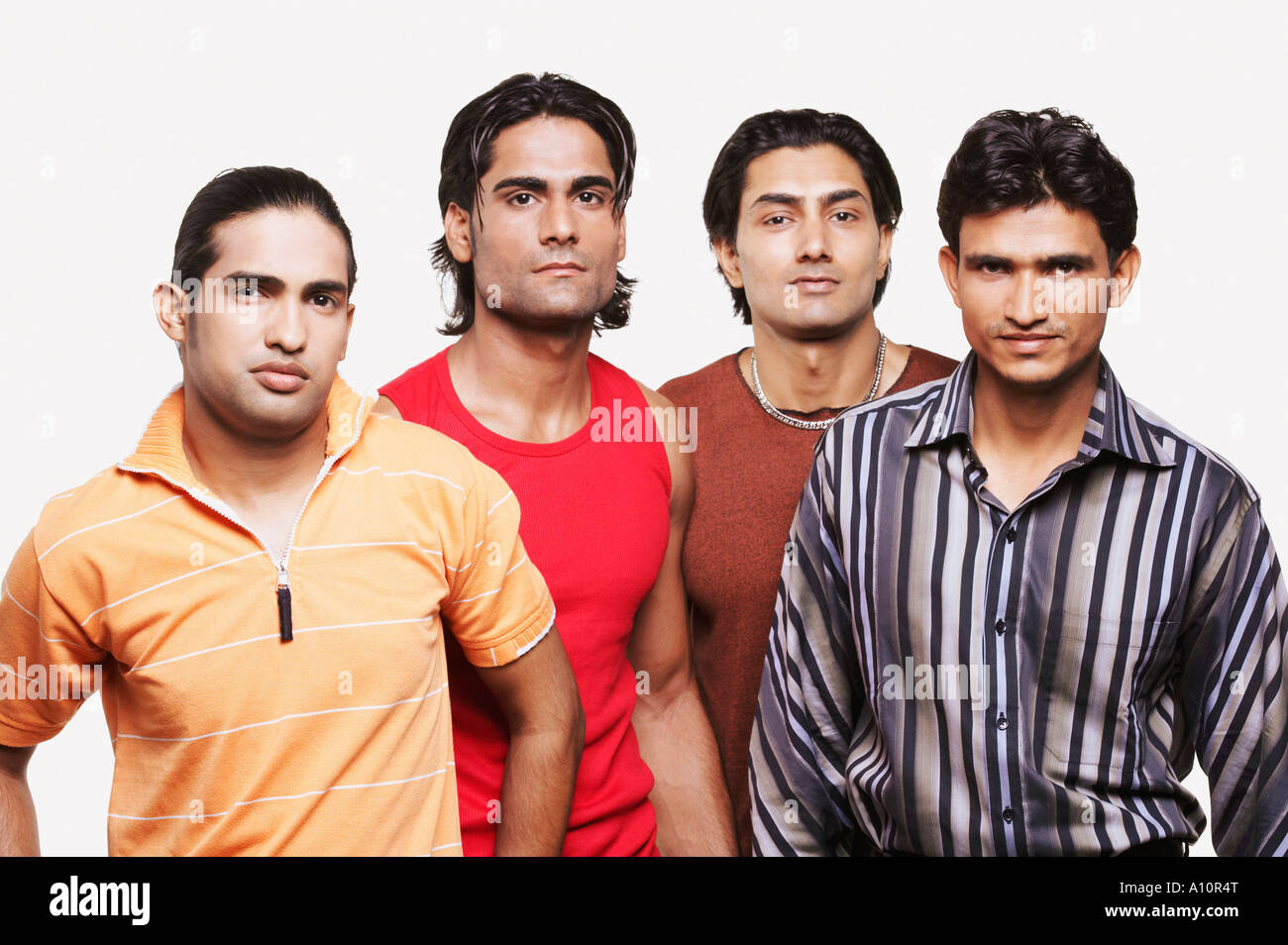 Portrait of four young men standing Stock Photo - Alamy