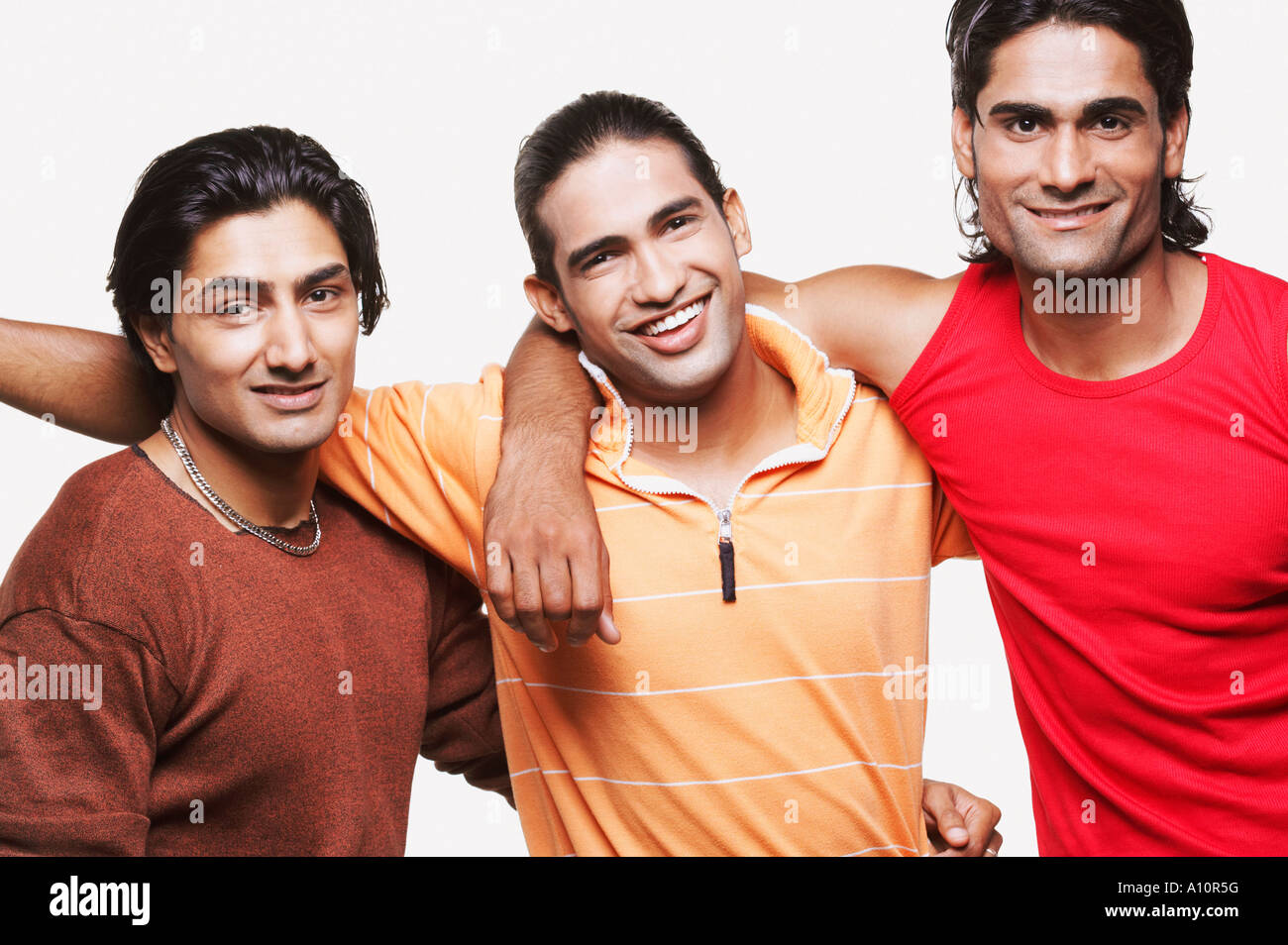 Portrait of three young men with their arms around each other Stock ...