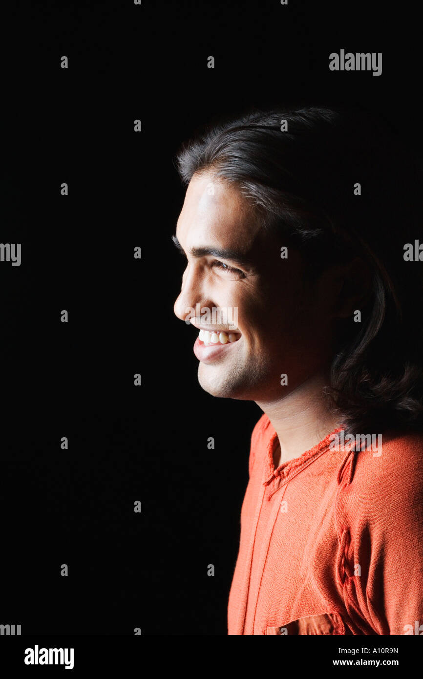 Side profile of a young man smiling Stock Photo - Alamy