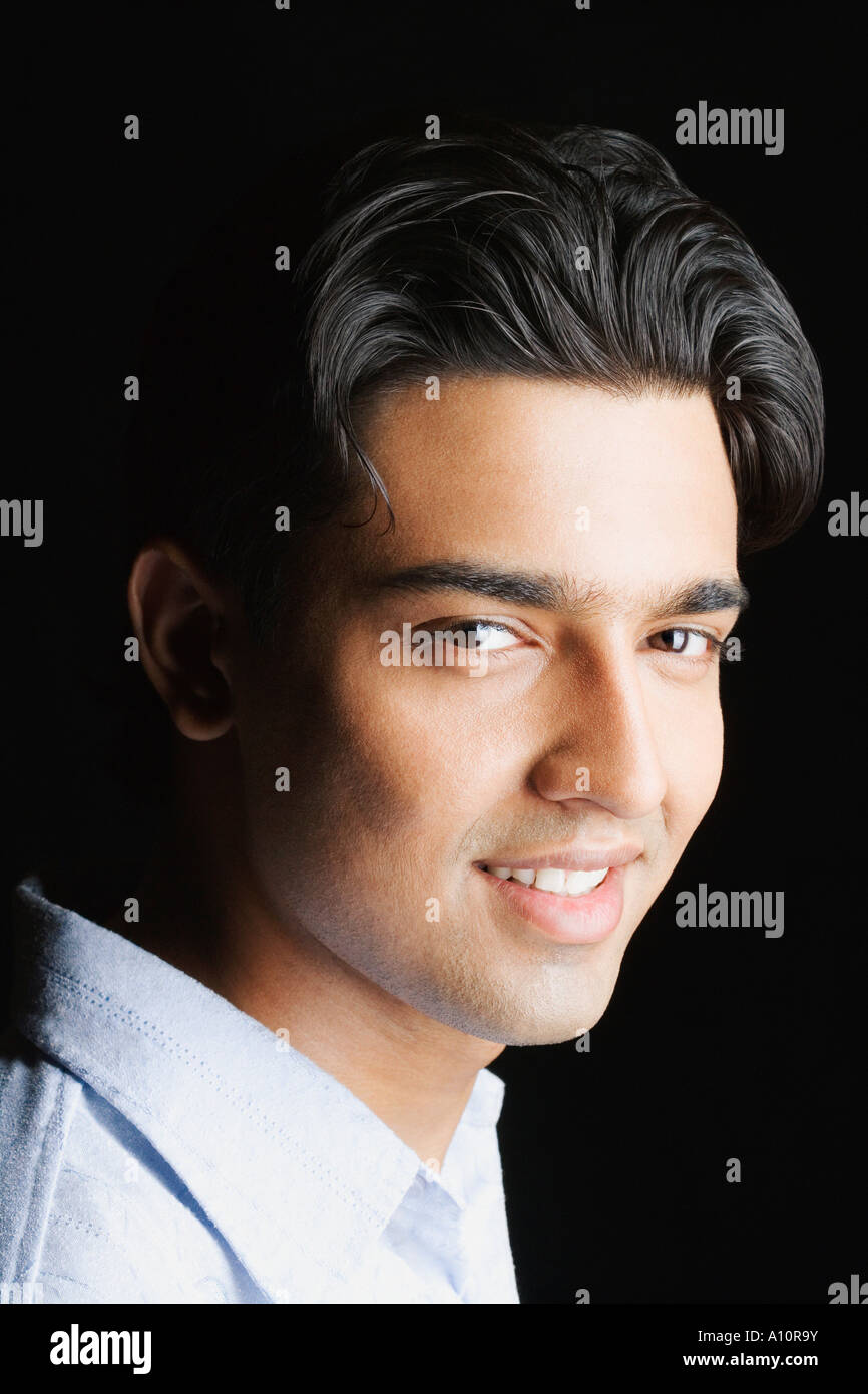 Portrait of a young man smiling Stock Photo - Alamy