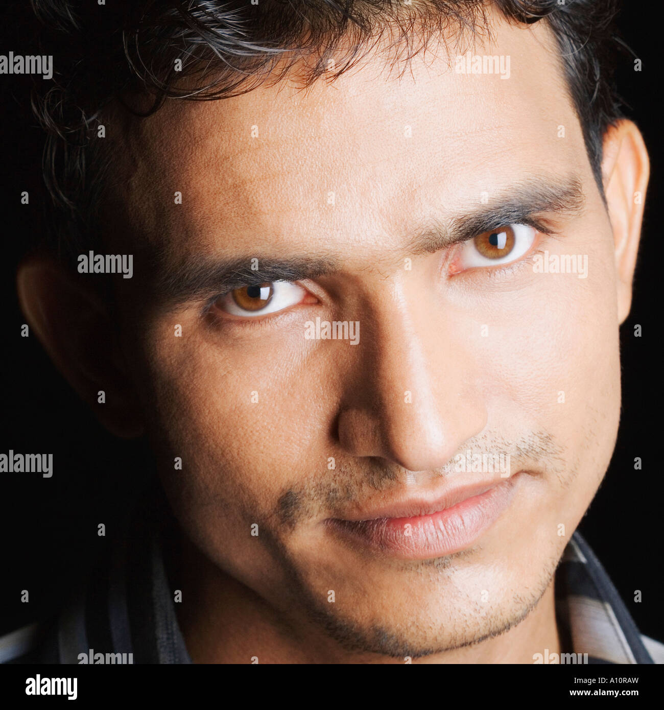 Portrait of a young man looking serious Stock Photo - Alamy