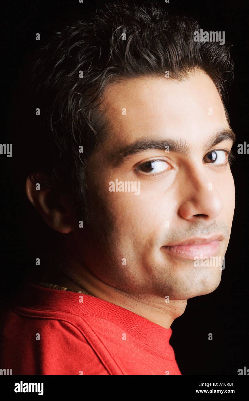 Portrait of a young man looking serious Stock Photo - Alamy