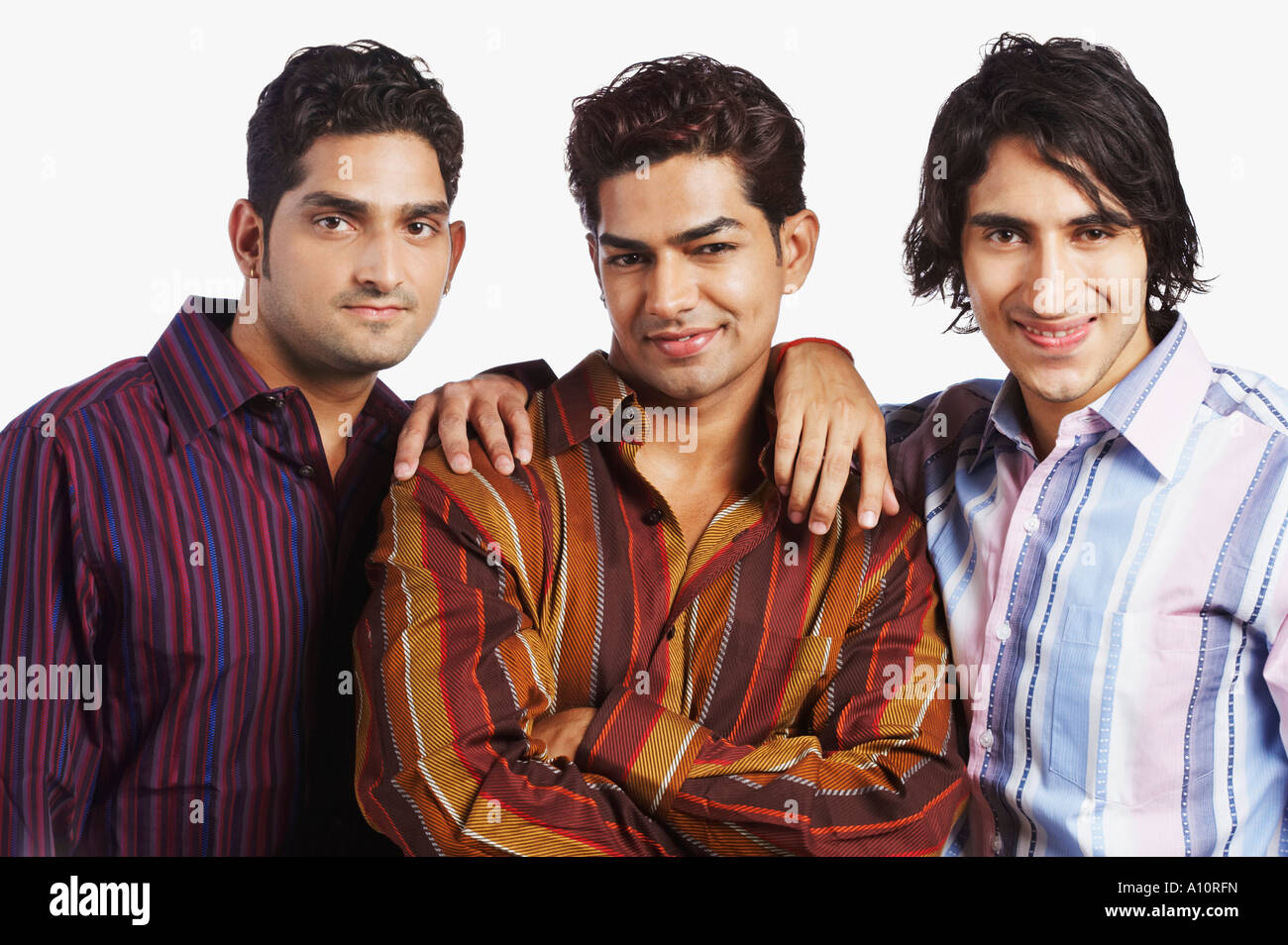 Portrait of three young men smiling Stock Photo - Alamy