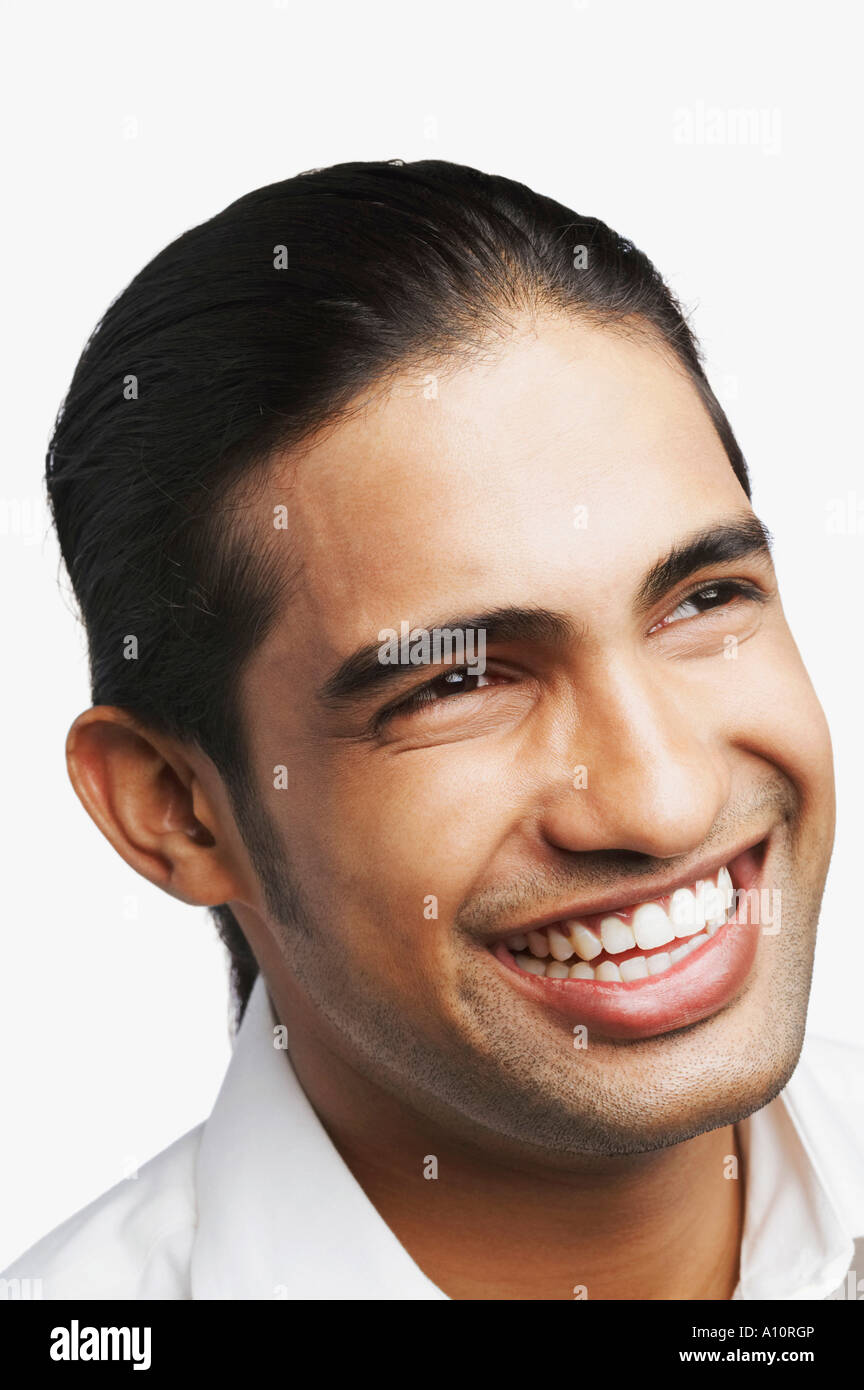 Close-up of a young man smiling Stock Photo - Alamy