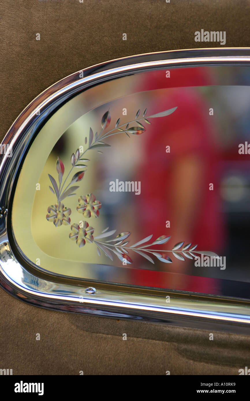 Abstract detail showing cut glass design on window of a classic car in ...