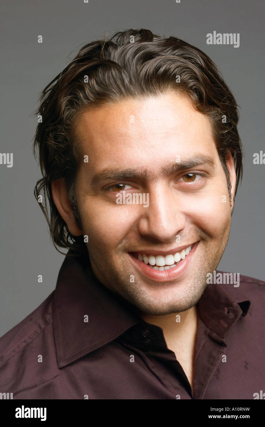 Portrait of a young man smiling Stock Photo - Alamy