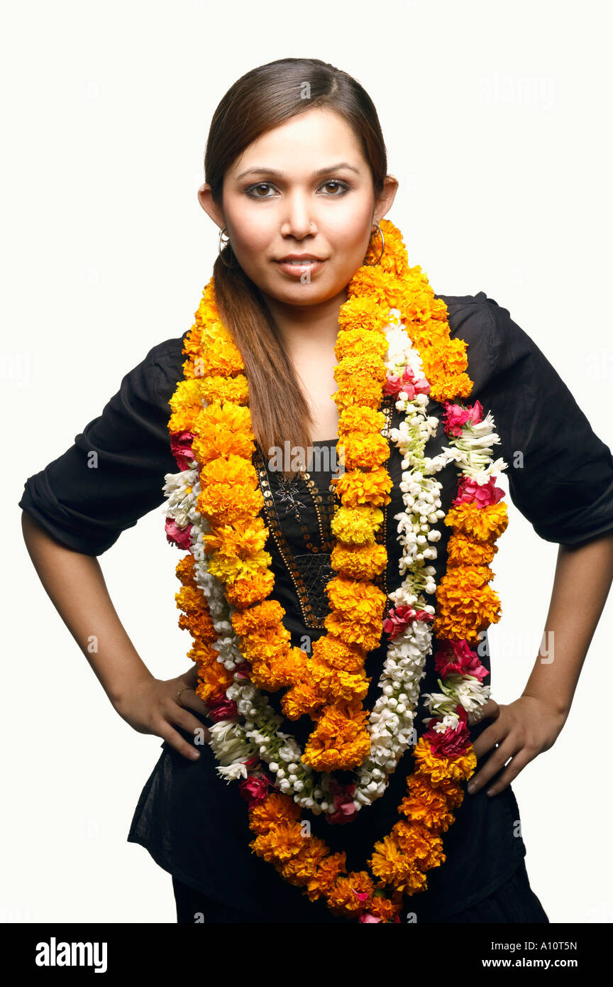 Portrait of a young woman wearing garlands Stock Photo - Alamy