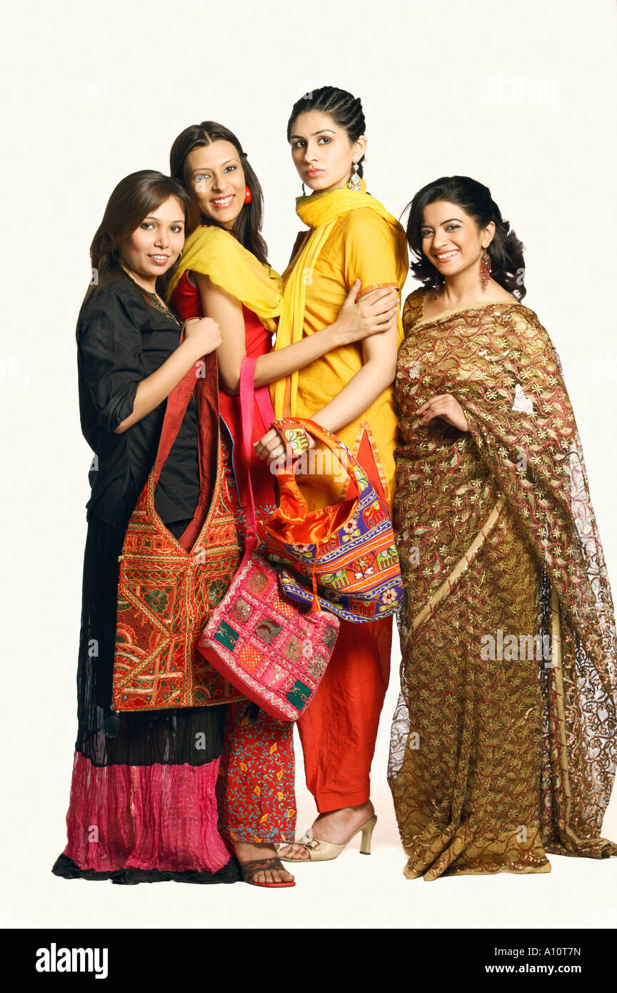 Portrait of four young women standing together Stock Photo - Alamy