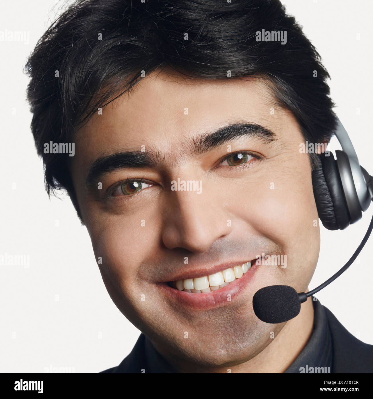 Portrait of a male customer service representative smiling Stock Photo ...
