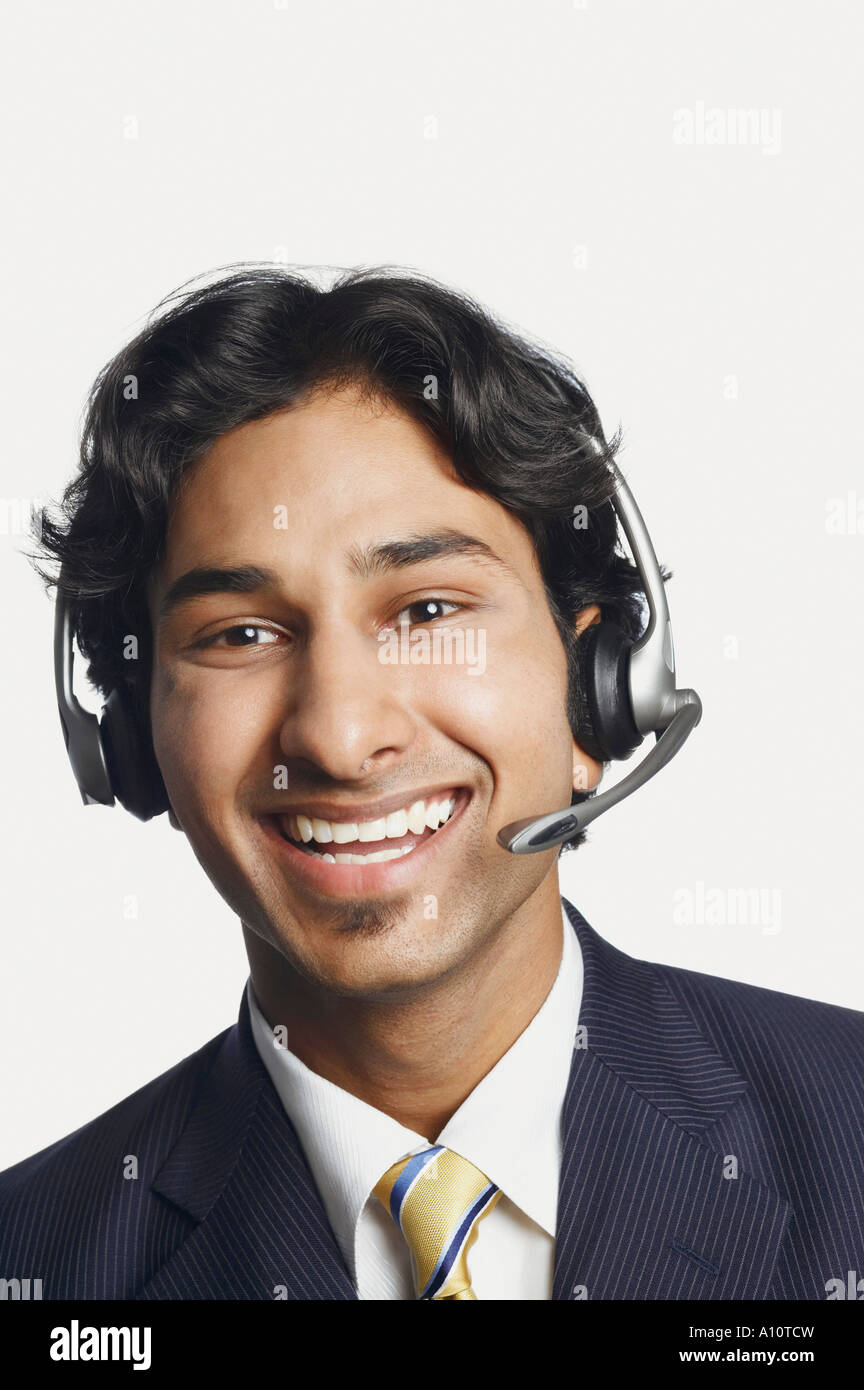 Portrait of a male customer service representative smiling Stock Photo ...