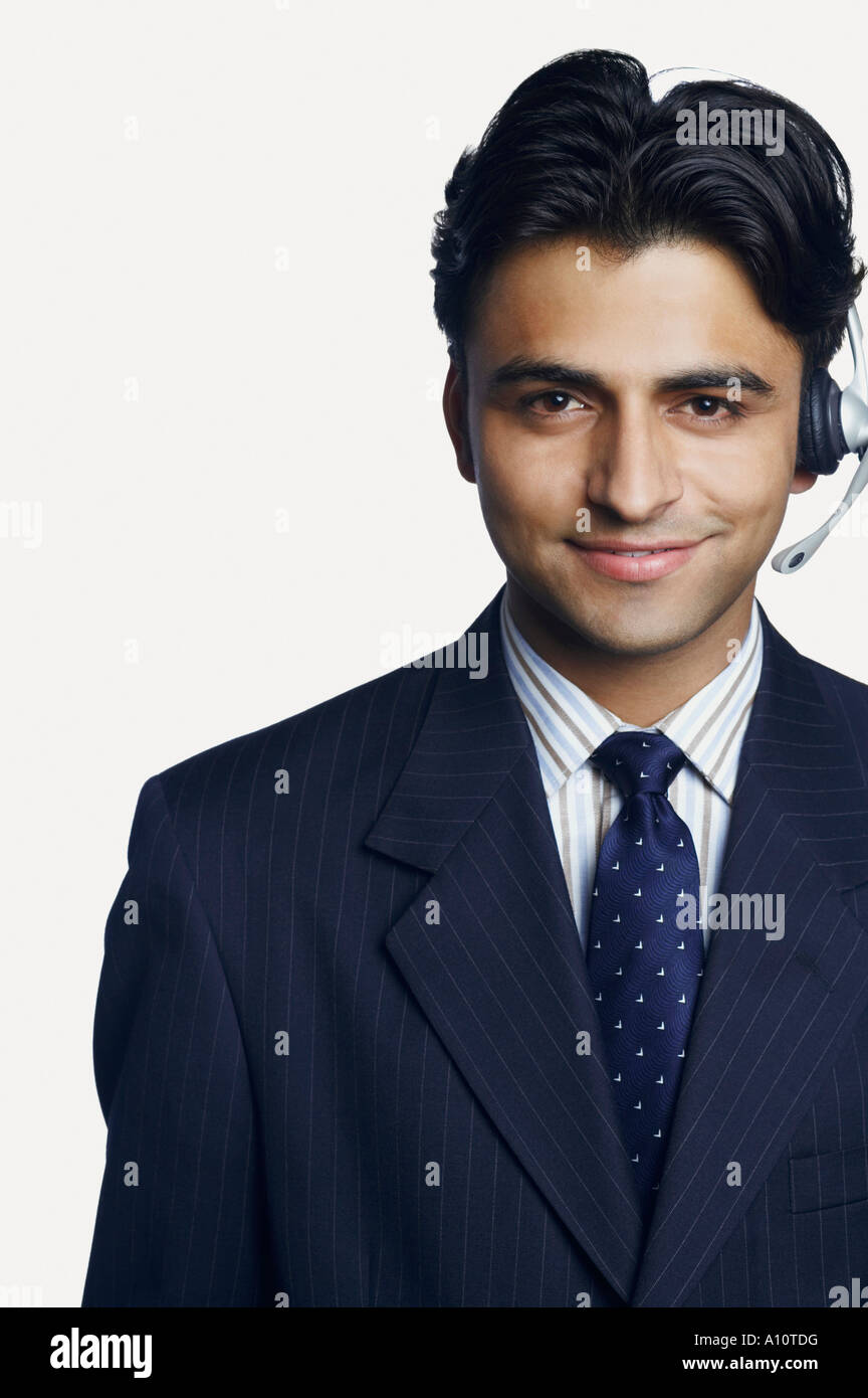 Portrait of a male customer service representative smiling Stock Photo ...