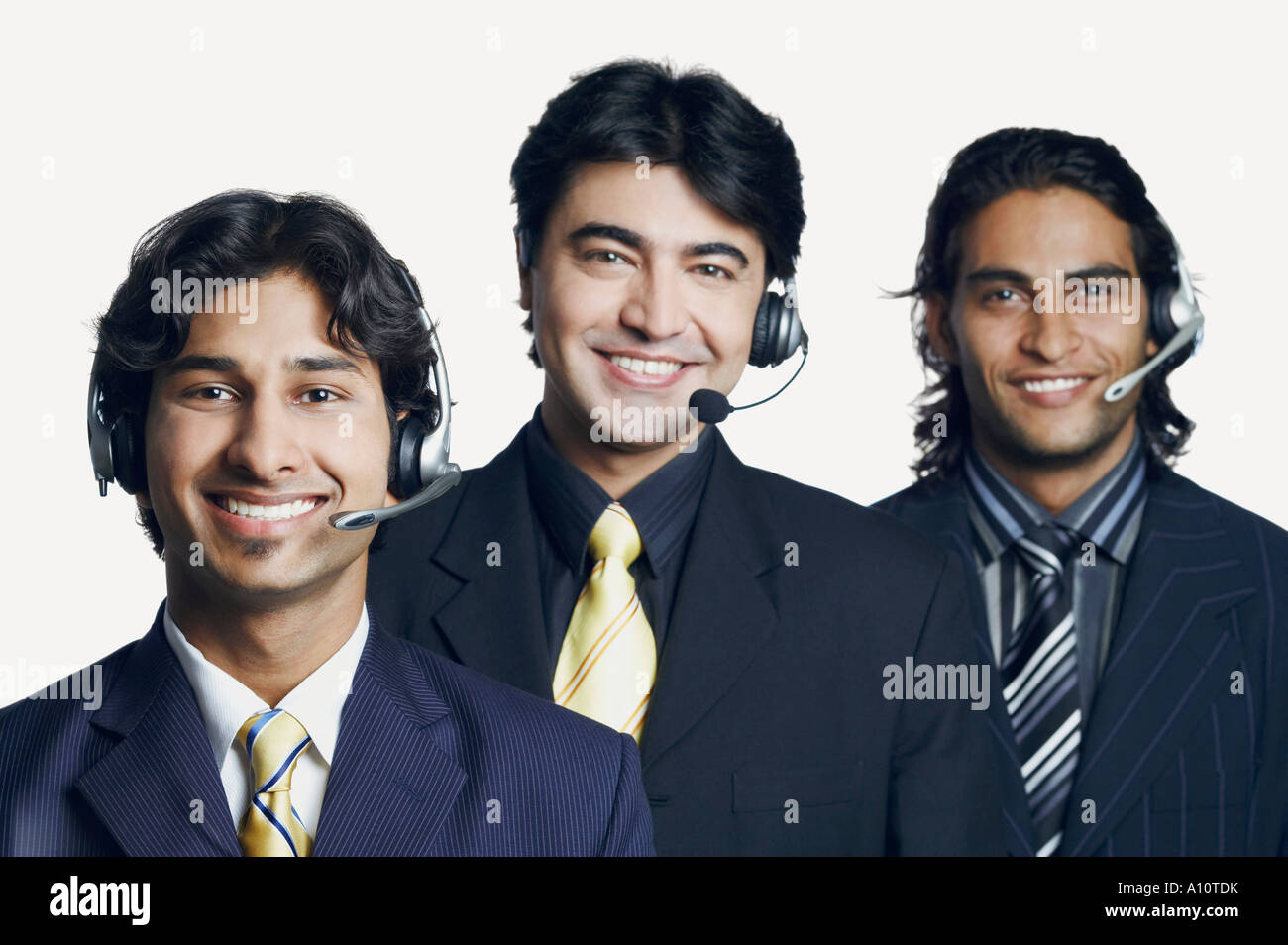 Portrait of three male customer service representatives smiling Stock Photo - Alamy