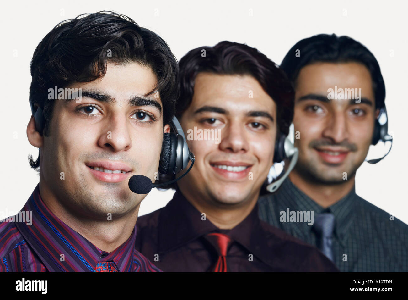 Portrait of three male customer service representatives smiling Stock Photo - Alamy
