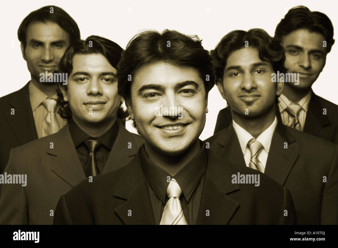 Portrait of five businessmen smiling Stock Photo - Alamy