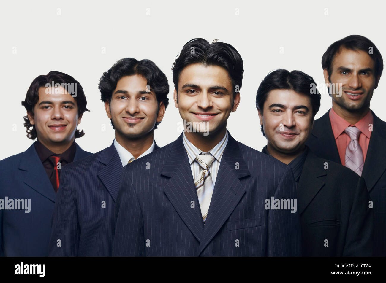 Portrait of five businessmen smiling Stock Photo - Alamy