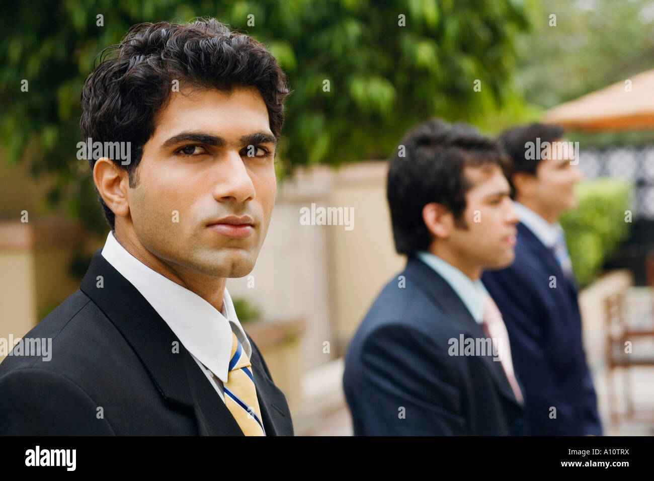 Portrait of a businessman looking serious Stock Photo - Alamy