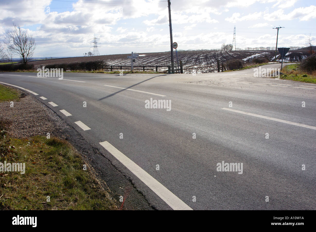 Junction in country lane Stock Photo - Alamy