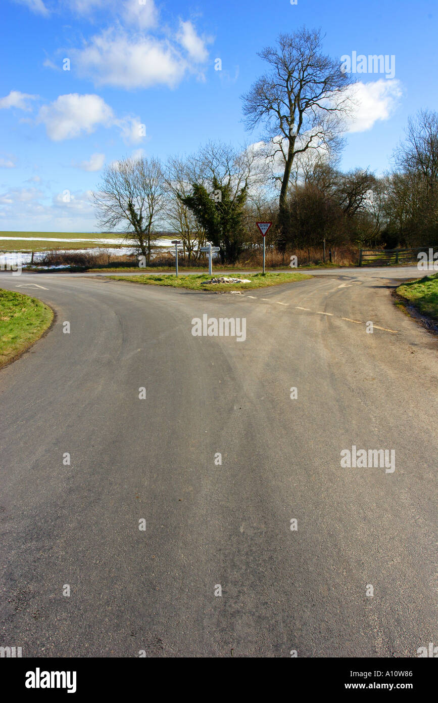 Junction in country lane Stock Photo - Alamy