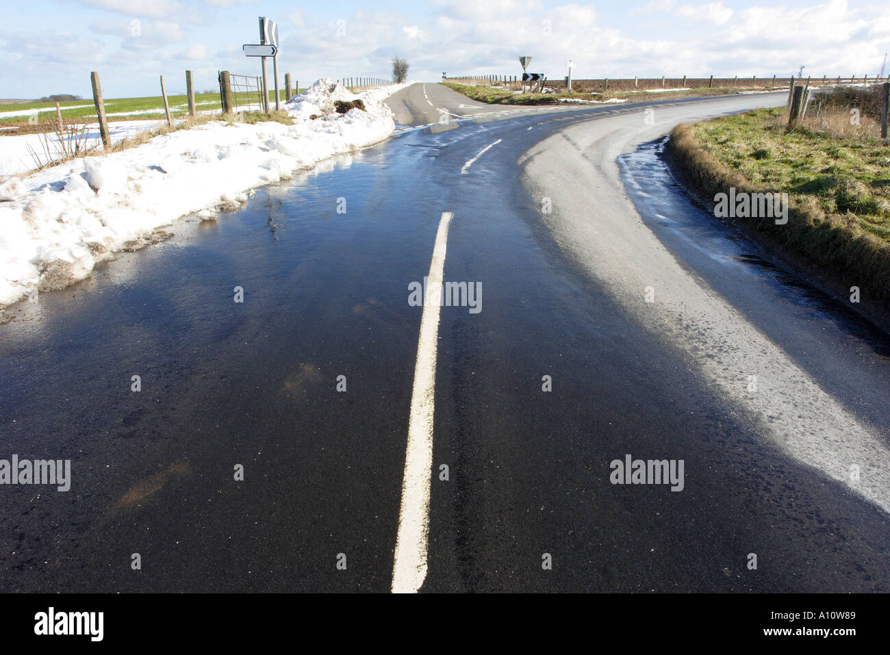 Junction in country lane Stock Photo - Alamy
