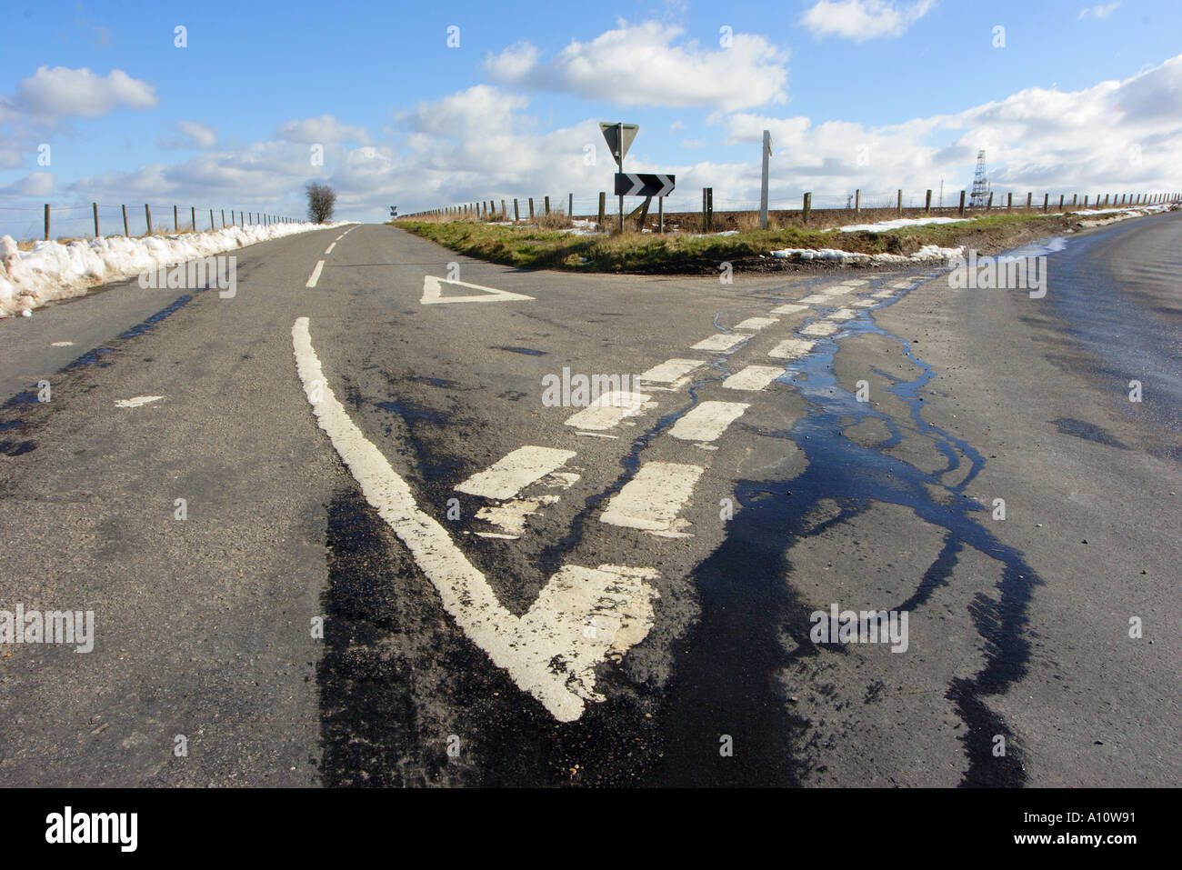 Junction in country lane Stock Photo - Alamy