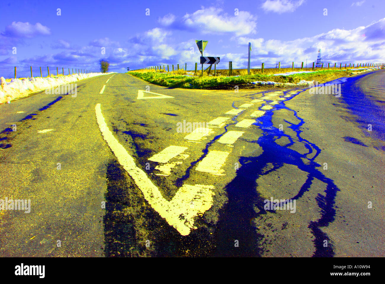 Junction in country lane Stock Photo - Alamy