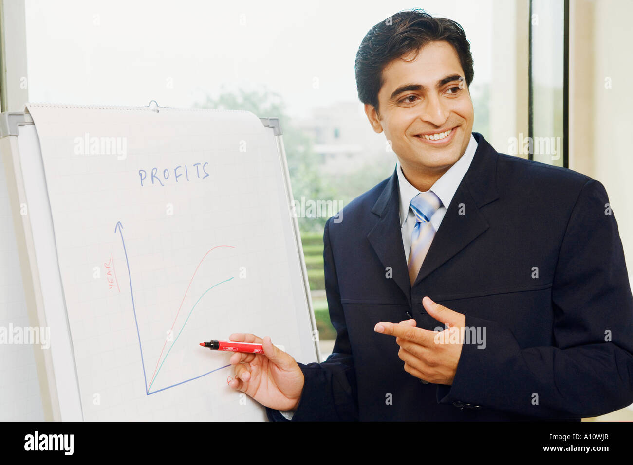 Businessman explaining graph on whiteboard hi-res stock photography and ...